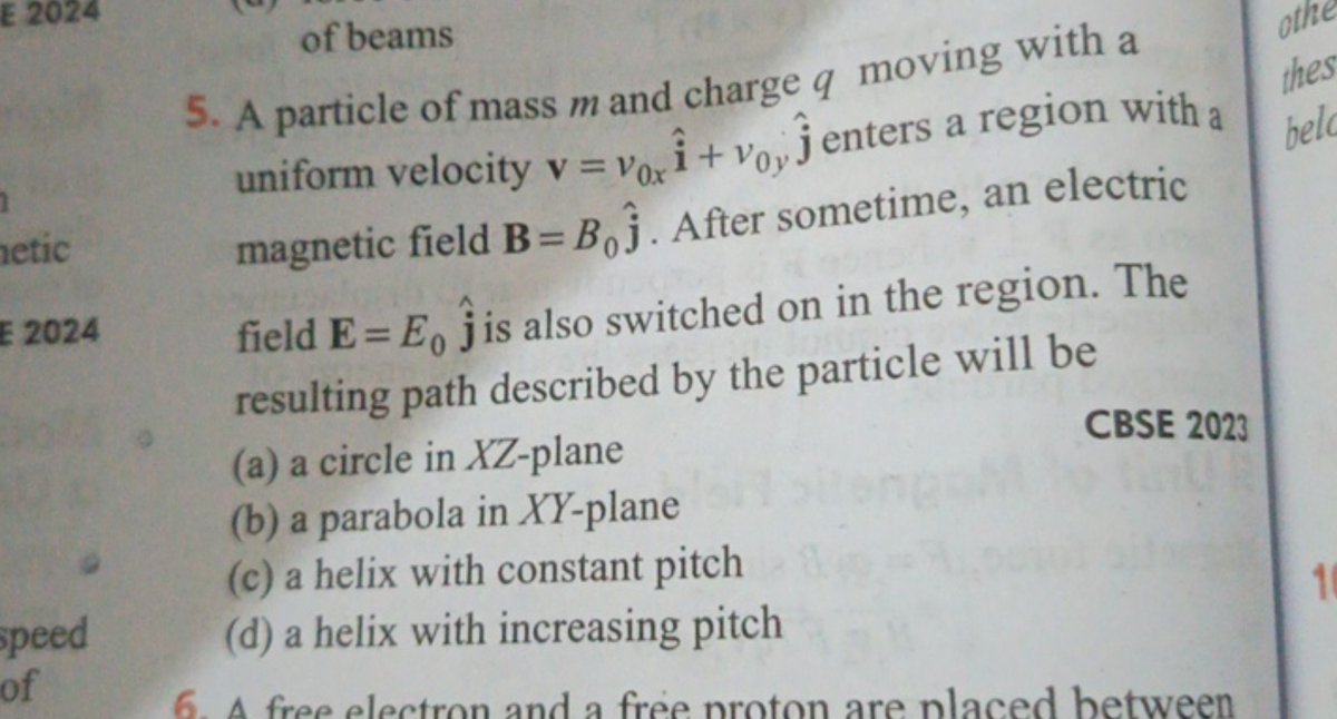 A particle of mass m and charge q moving with a uniform velocity \mathbf..