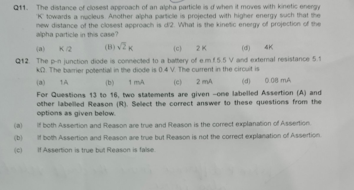 Q11. The distance of closest approach of an alpha particle is d when it m..