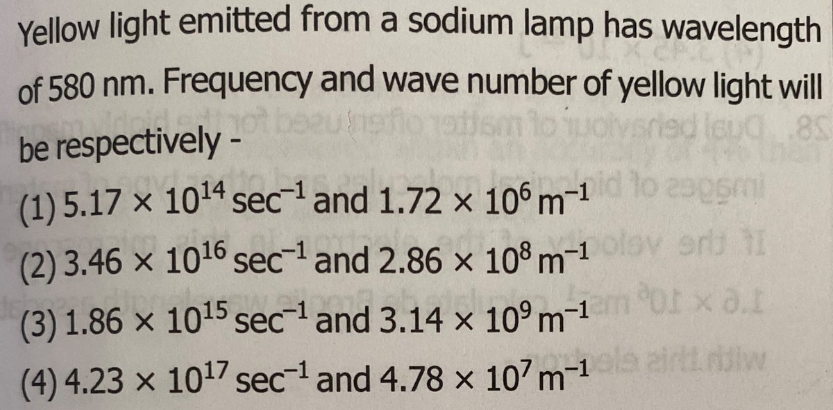Yellow light emitted from a sodium lamp has wavelength of 580 nm . Freque..