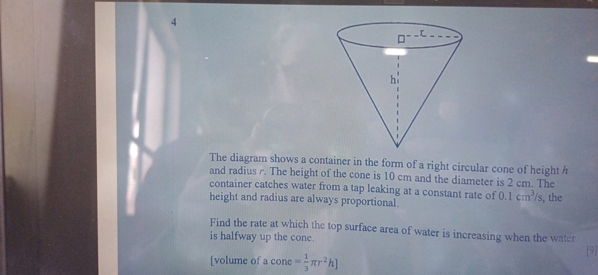 The diagram shows a container in the form of a right circular cone of hei..