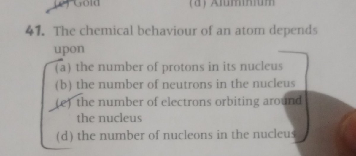 What does the chemical behavior of an atom depend upon? (a) The number of..