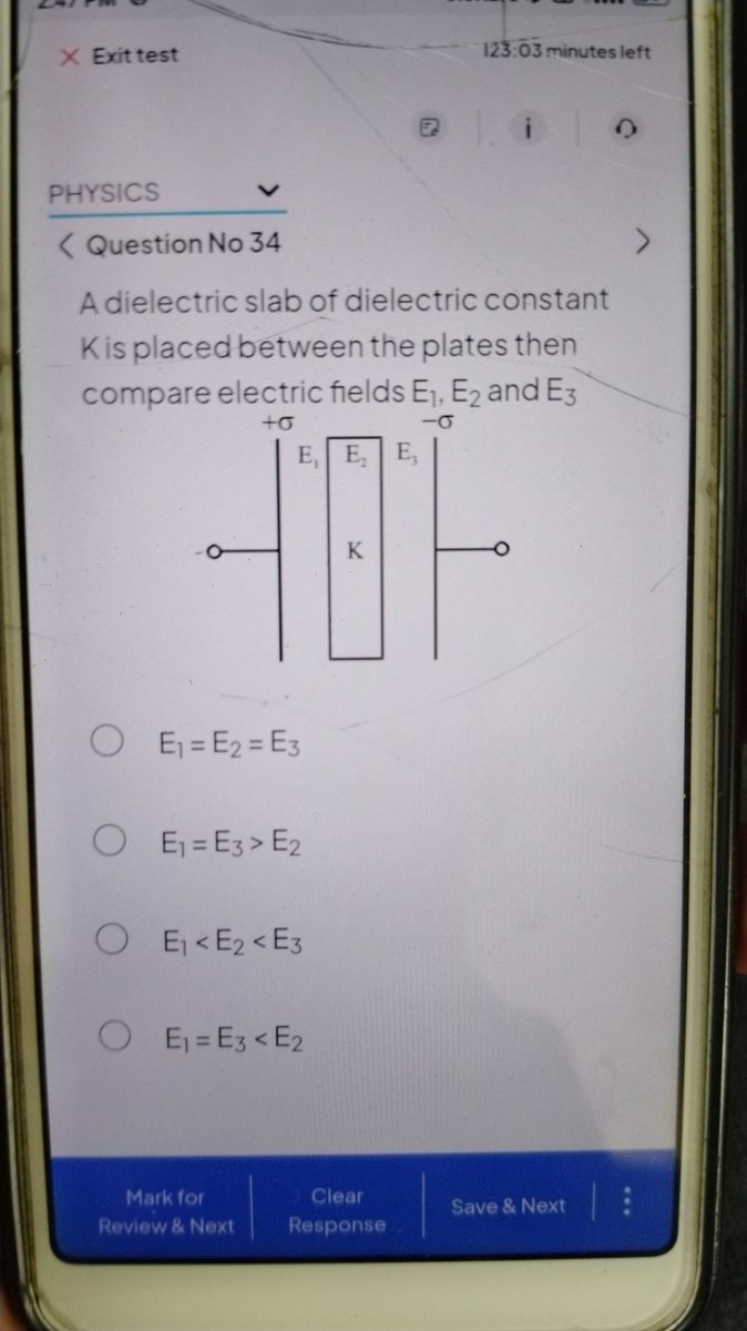 A dielectric slab of dielectric constant K is placed between the plates t..