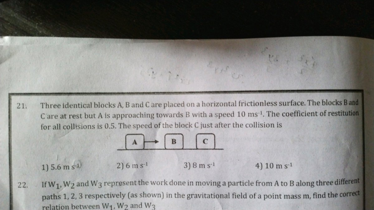 Three identical blocks A, B, and C are placed on a horizontal frictionles..