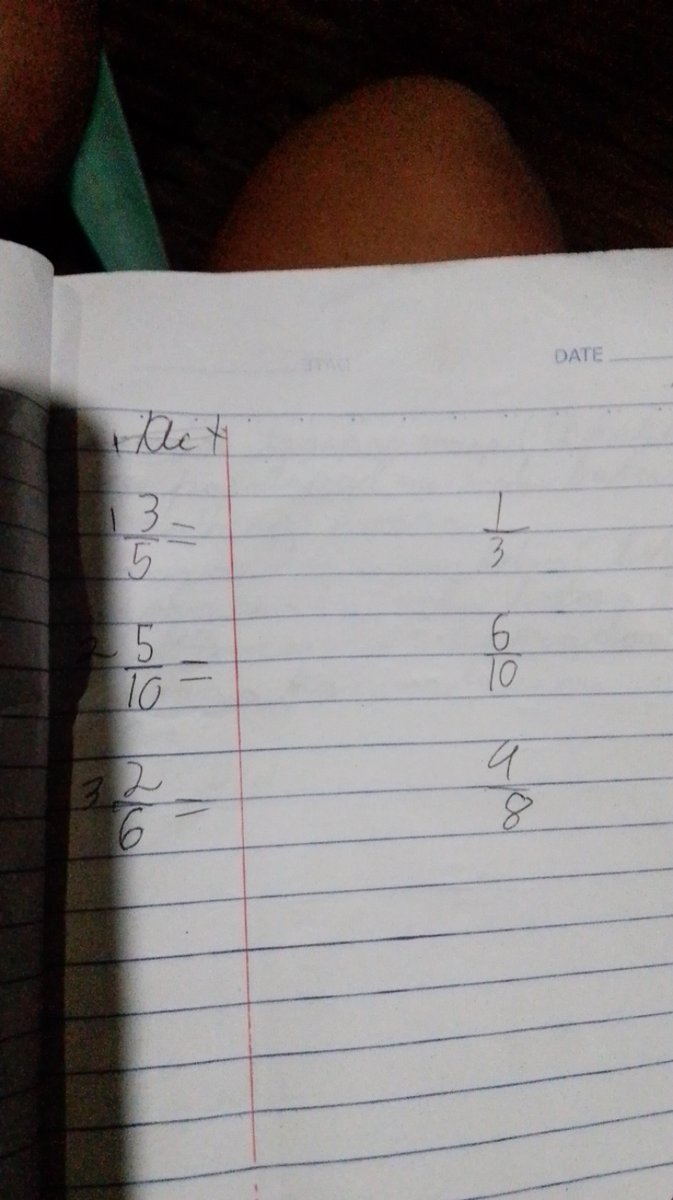 The image shows a handwritten math problem with fractions. It appears to