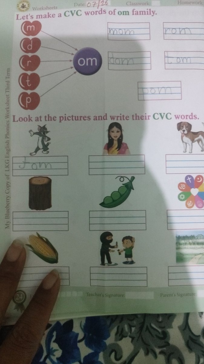Let's make CVC words of the "om" family. Look at the pictures and write