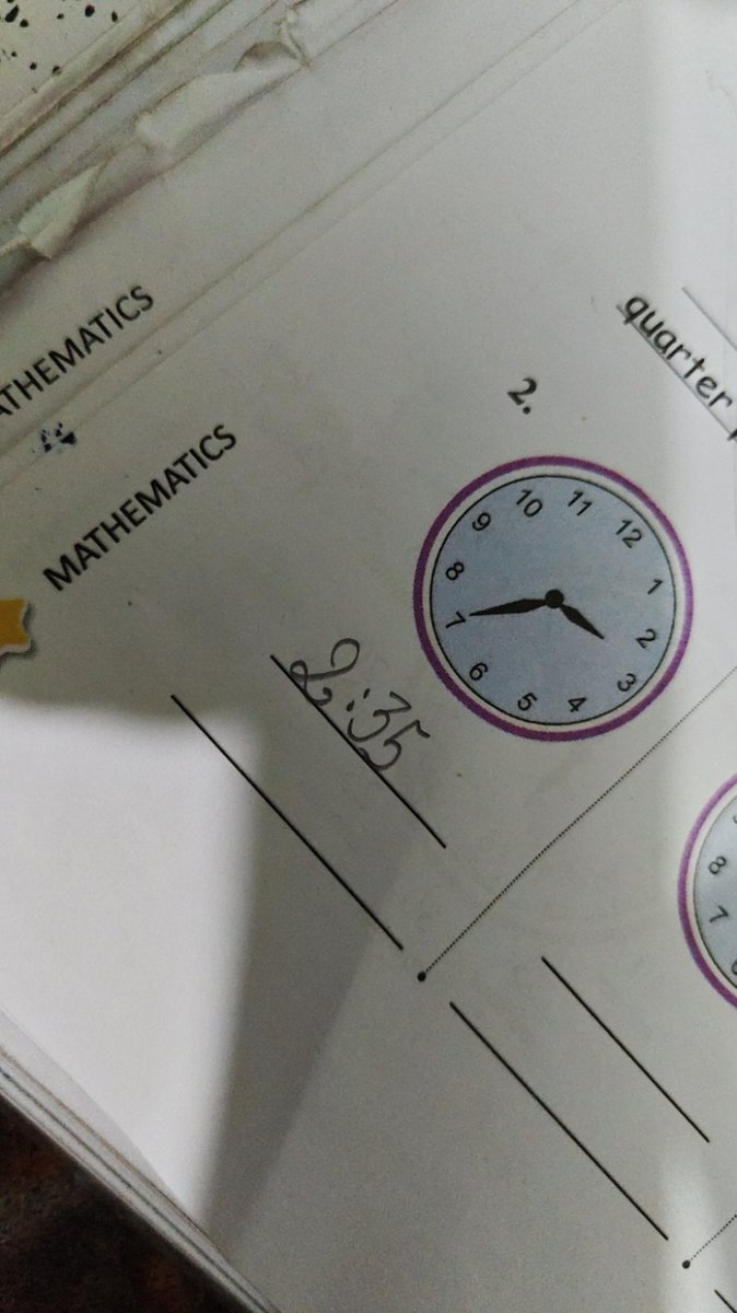 The image shows a clock face with the time 2:35 written next to it. The c..