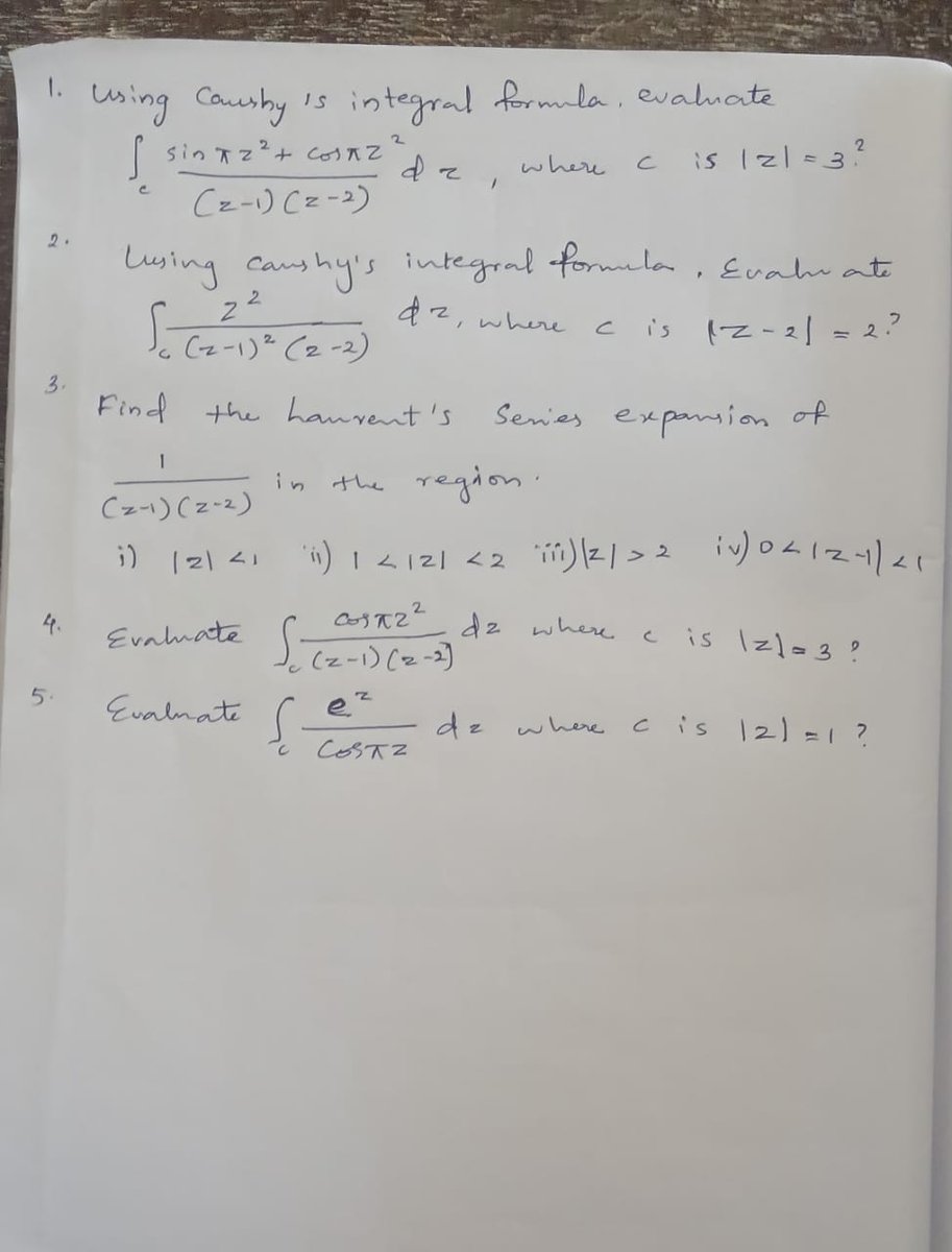 Using Cauchy's integral formula, evaluate \int_C \frac{\sin(\pi z^2)