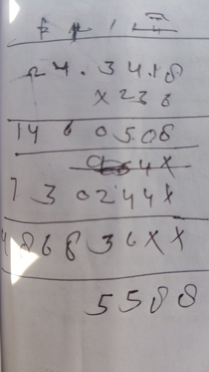 The image shows a handwritten multiplication problem: 24.3418 x 23..