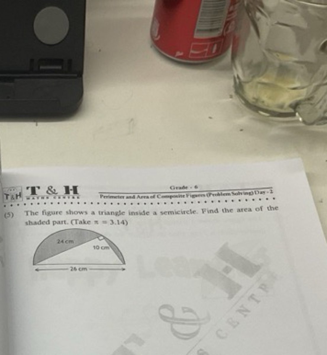 The figure shows a triangle inside a semicircle. Find the area of the sha..