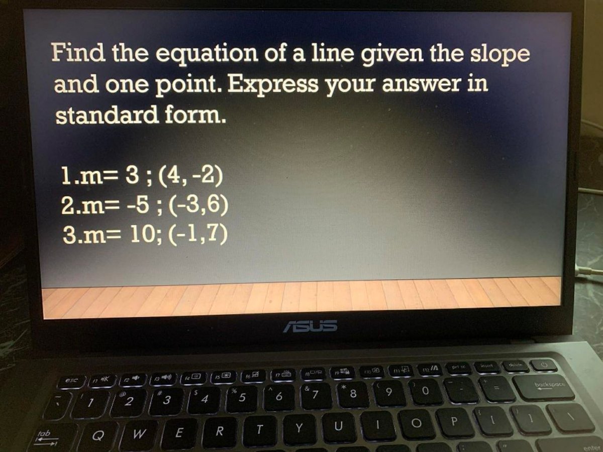 Find the equation of a line given the slope and one point. Express your a..
