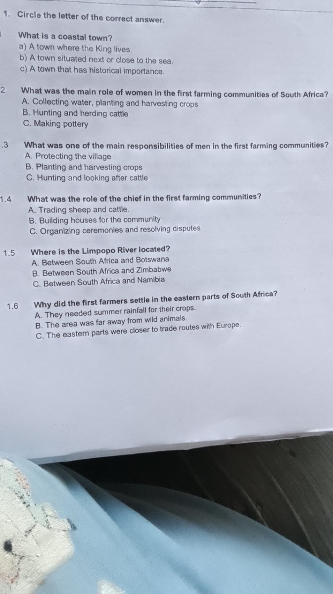 Circle the letter of the correct answer. 1.1 What is a coastal town? a)