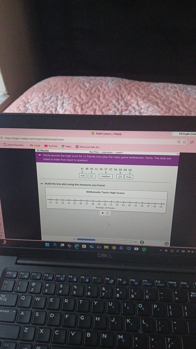 Olivia records the high score for 11 friends who play the video game Math..