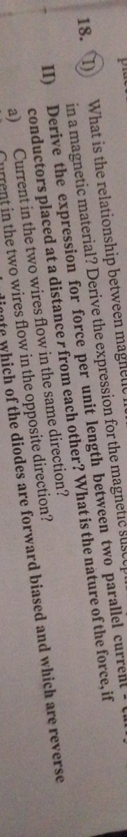 I) What is the relationship between magnetic moment in a magnetic materia..