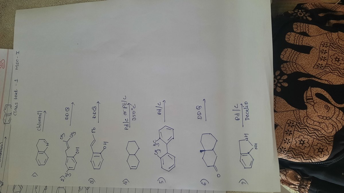 The image shows a series of organic chemistry reactions, likely involving..