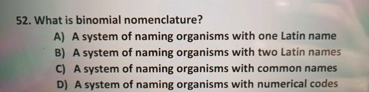 What is binomial nomenclature? A) A system of naming organisms with one L..
