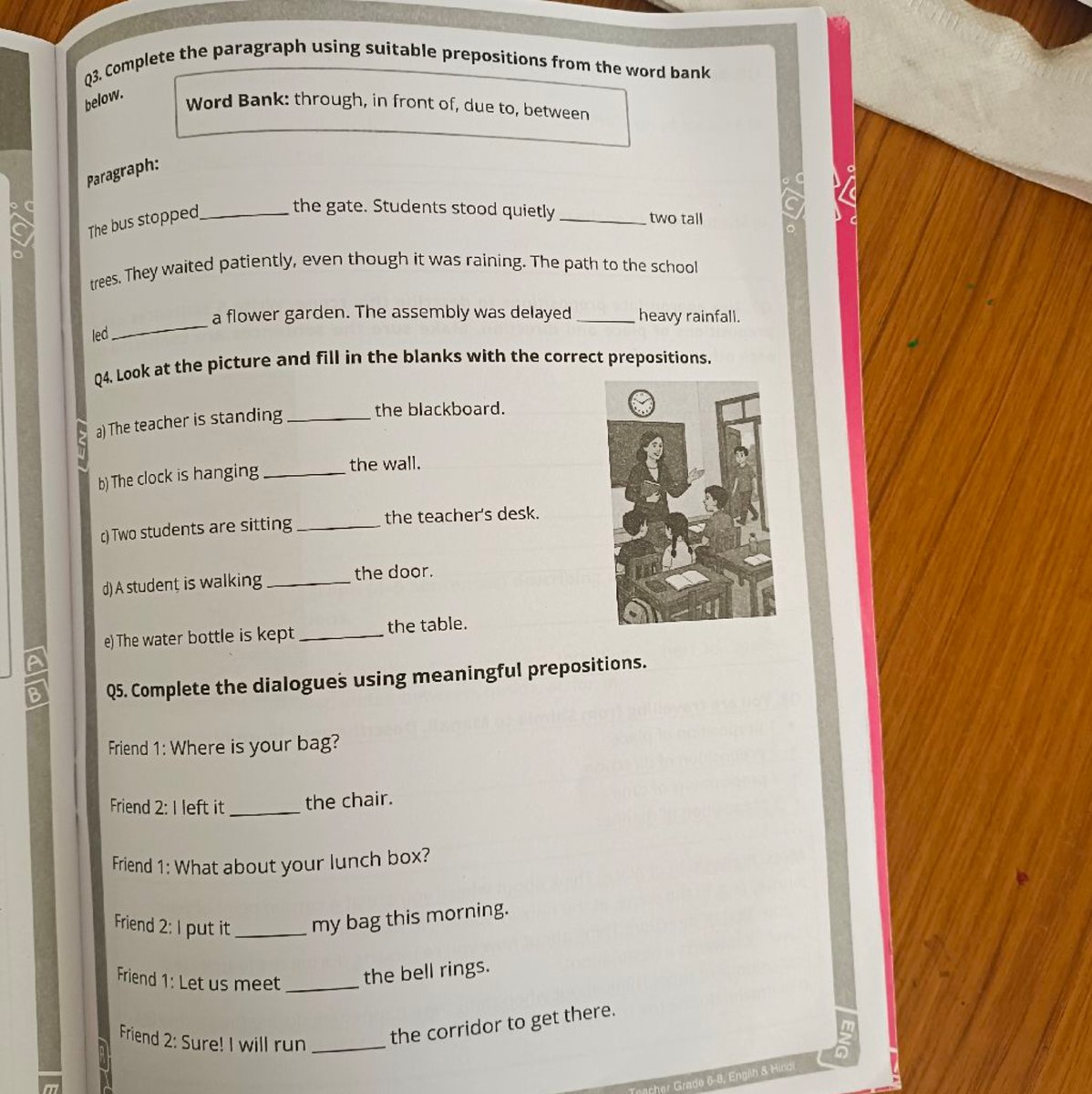 Q3. Complete the paragraph using suitable prepositions from the word bank..