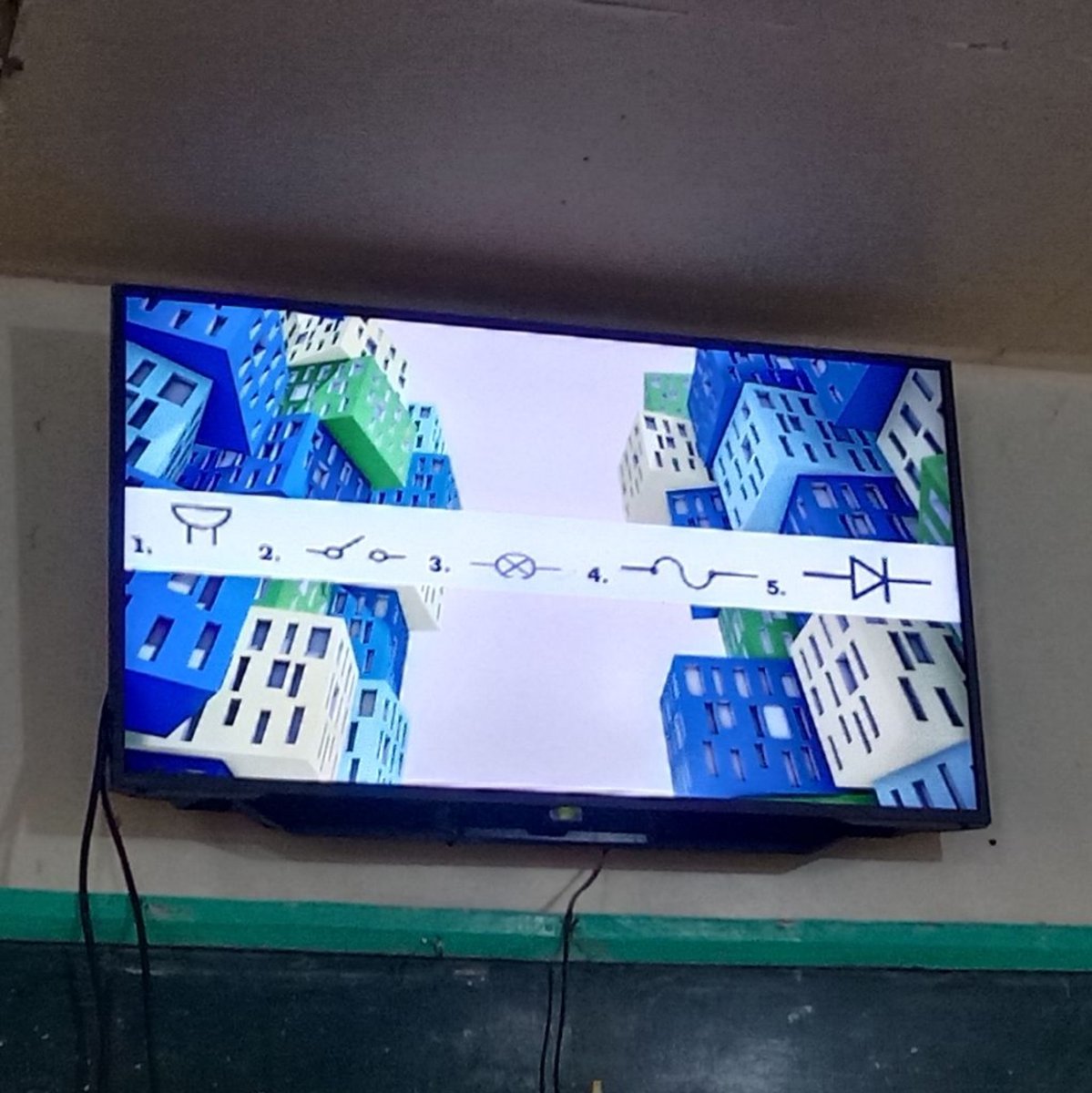 The image displays five different electrical symbols. The question is to