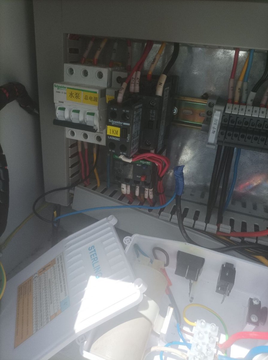 The provided image shows an electrical control panel with various compone..