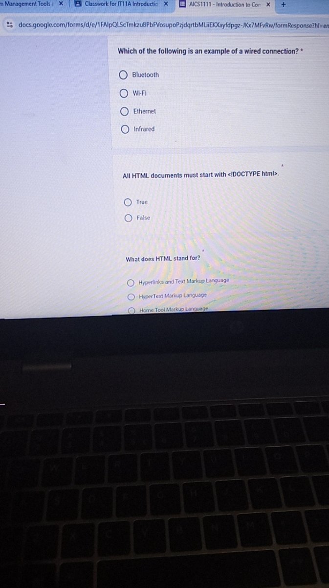 Which of the following is an example of a wired connection? Bluetooth Wi-..
