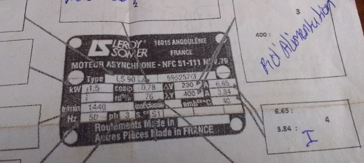 Based on the provided image of the motor's nameplate, what is the current..