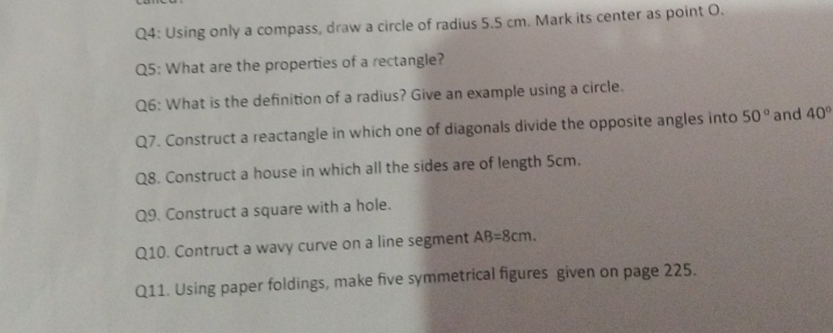 Q4: Using only a compass, draw a circle of radius 5.5 cm. Mark its center..