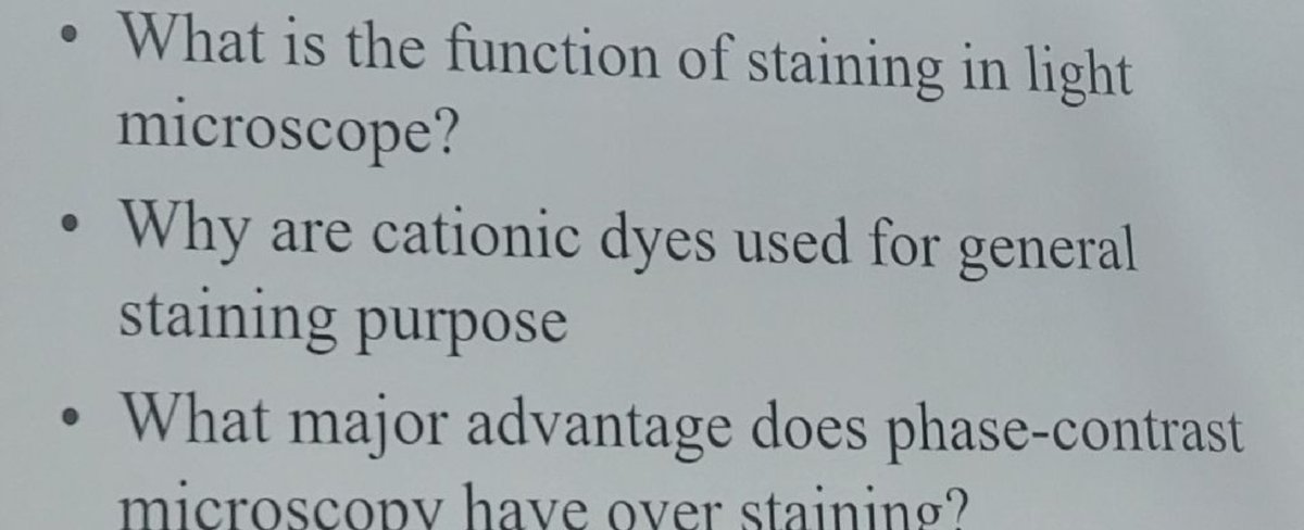What is the function of staining in light microscopy? Why are cationic dy..