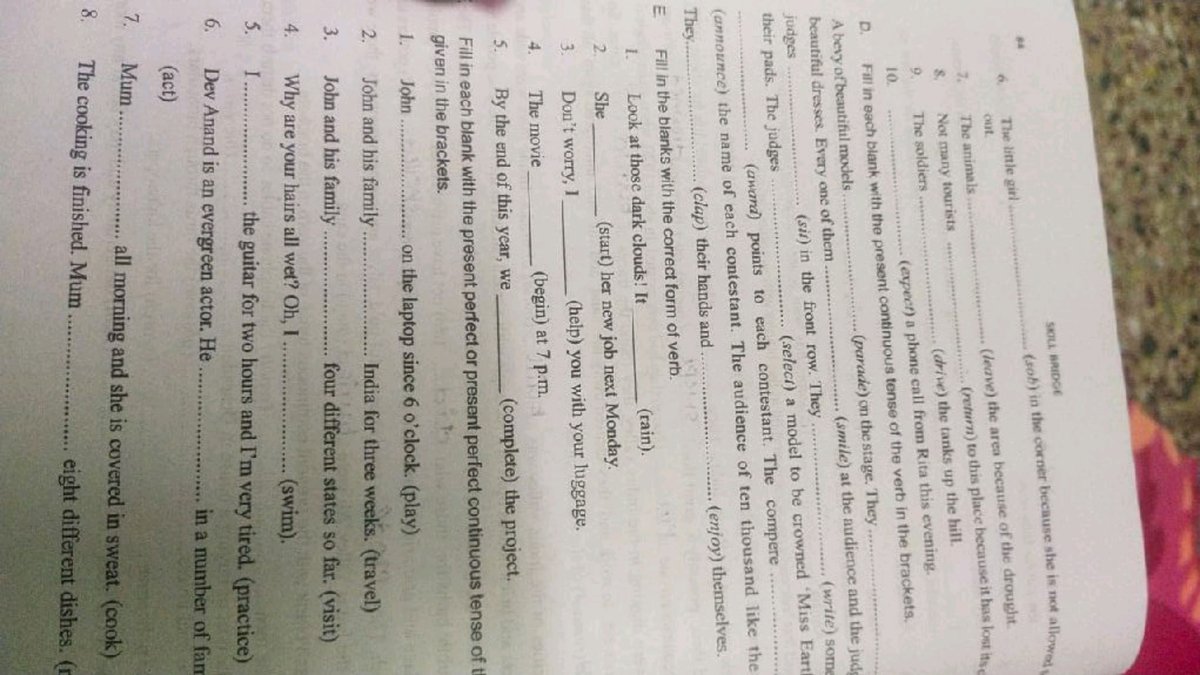 D. Fill in each blank with the present continuous tense of the verb in th..
