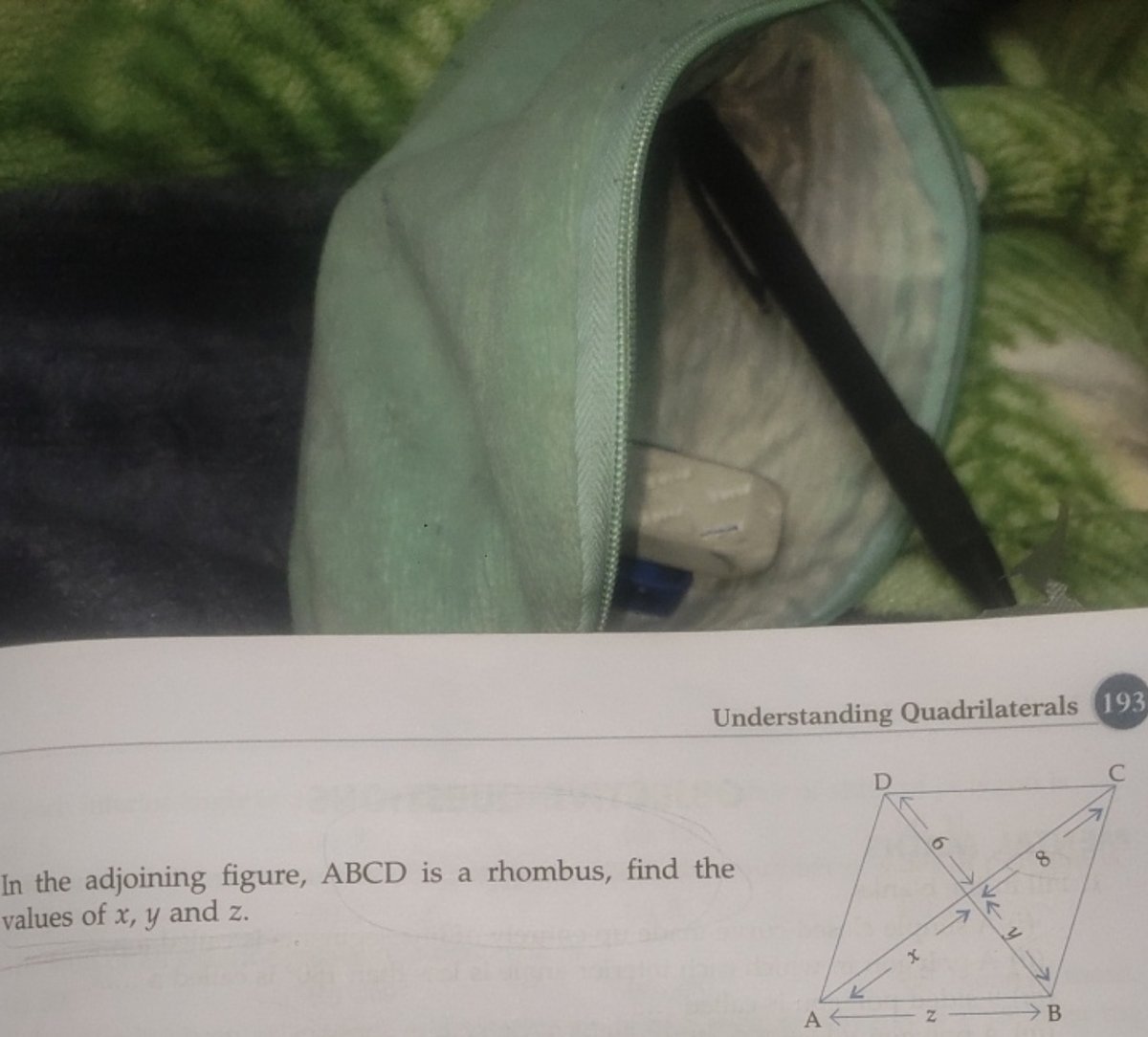 In the adjoining figure, ABCD is a rhombus, find the values of x, y and z..