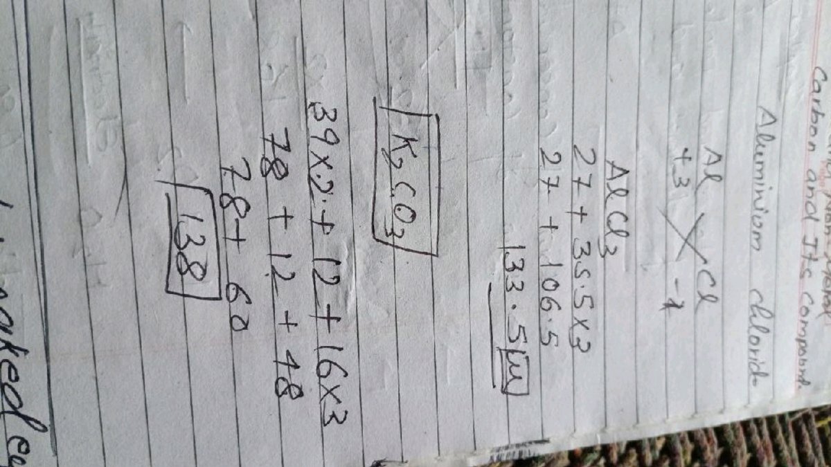 The image shows calculations for the molecular mass of Aluminium chloride..