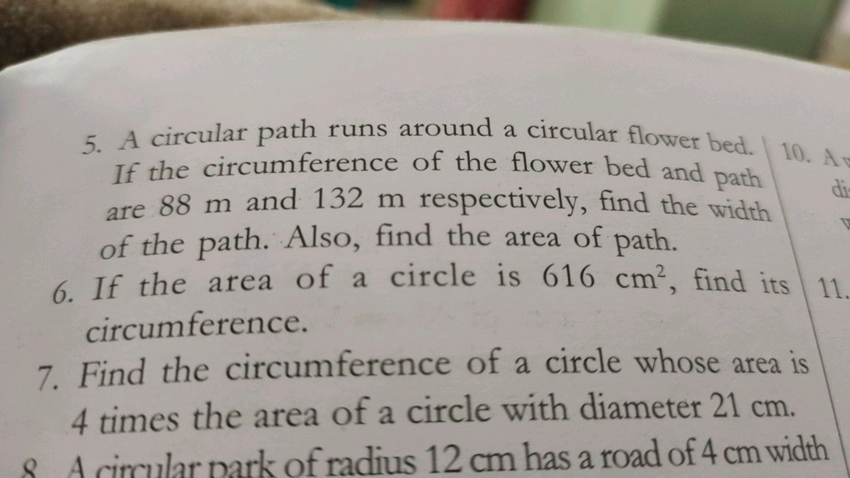A circular path runs around a circular flower bed. If the circumference o..