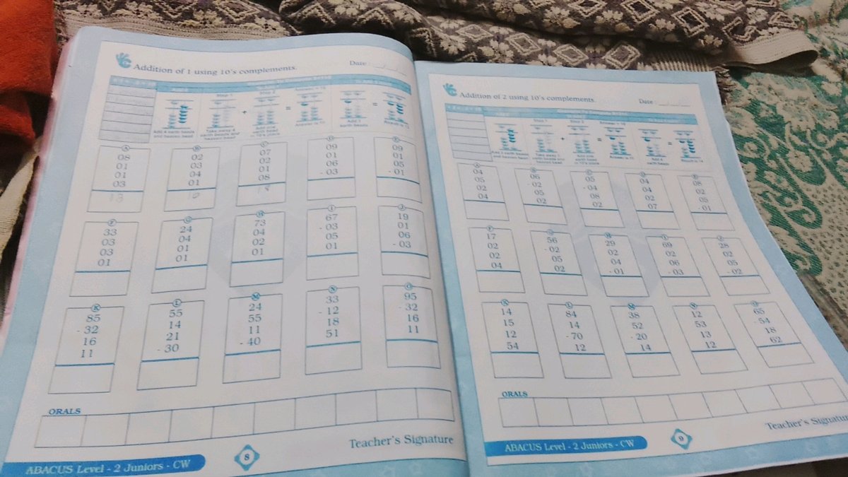 The image shows two pages from an "ABACUS Level - 2 Juniors - CW" workboo..