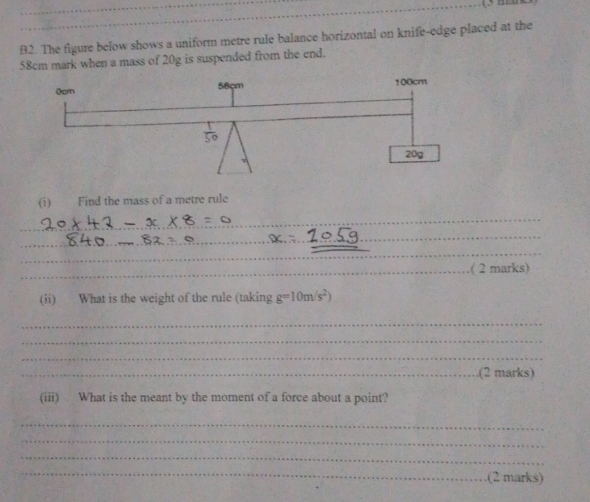 B2. The figure below shows a uniform metre rule balanced horizontally on
