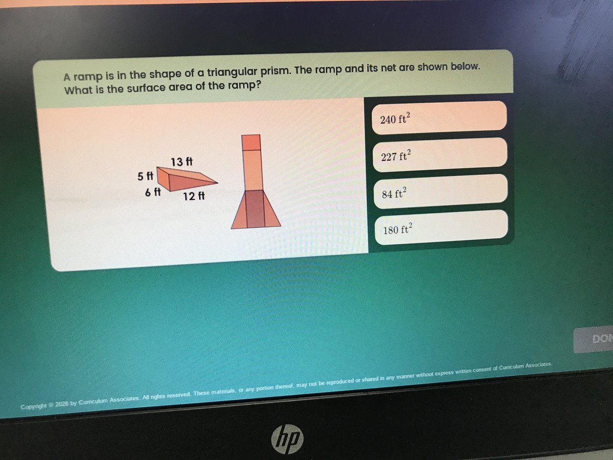 A ramp is in the shape of a triangular prism. The ramp and its net are sh..