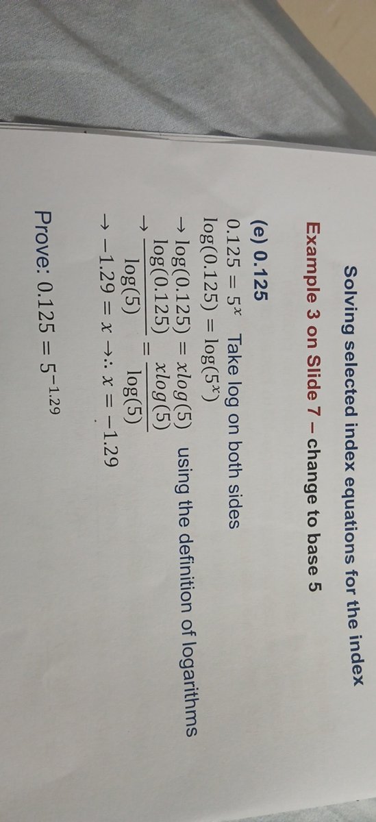 The provided image shows the steps to solve the equation 0.125 = 5^x. The..