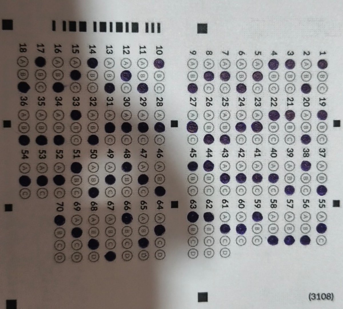 The user has provided an image of an OMR sheet with filled-in bubbles. Th..